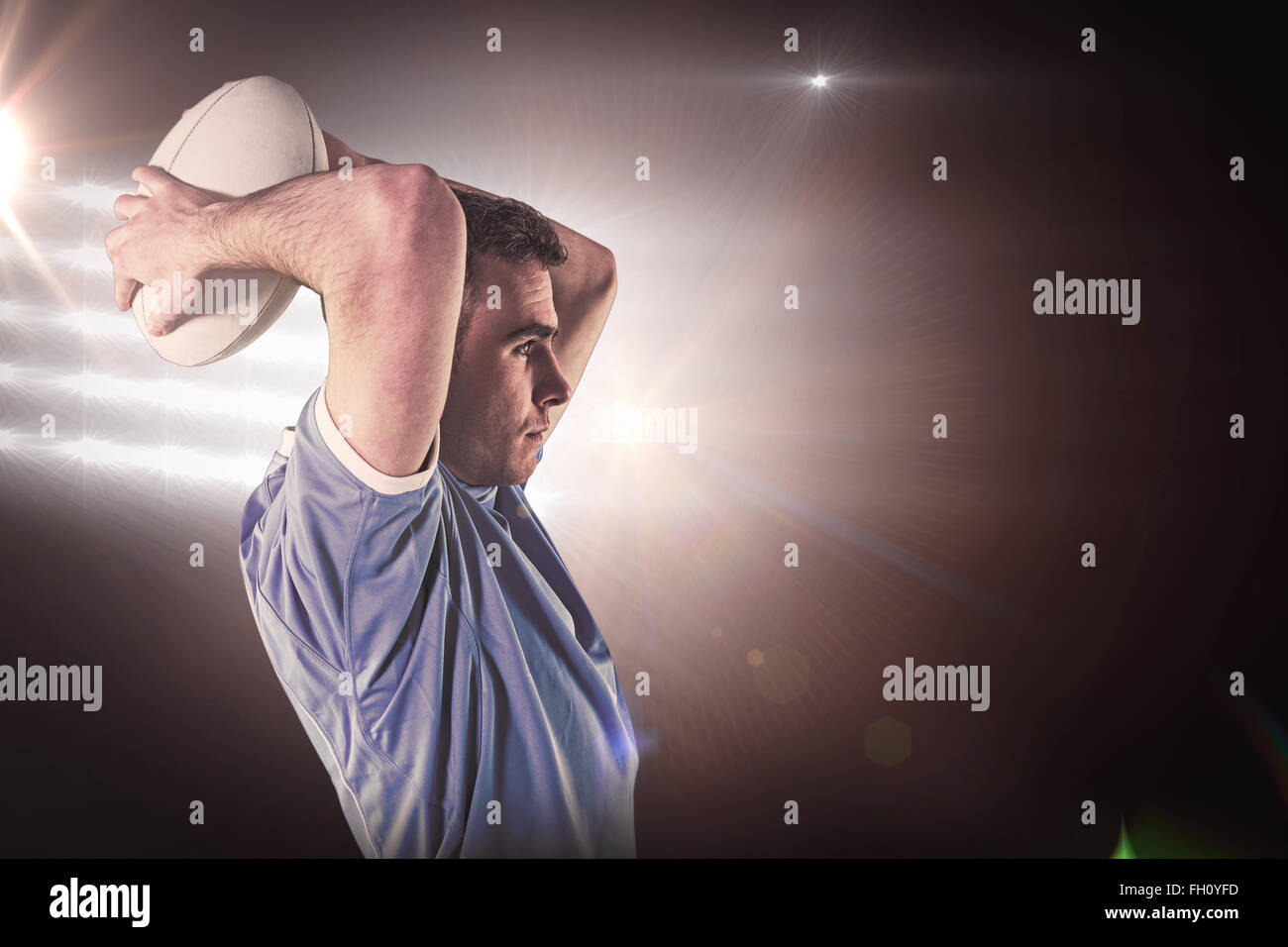 Composite image of rugby player about to throw a rugby ball Stock Photo ...