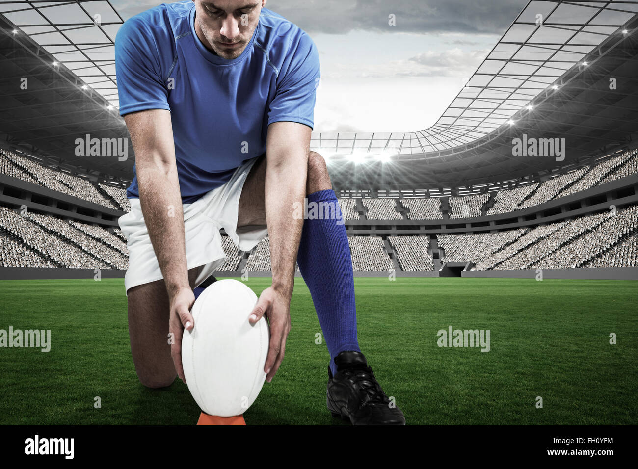Composite image of full length of rugby player placing ball Stock Photo ...