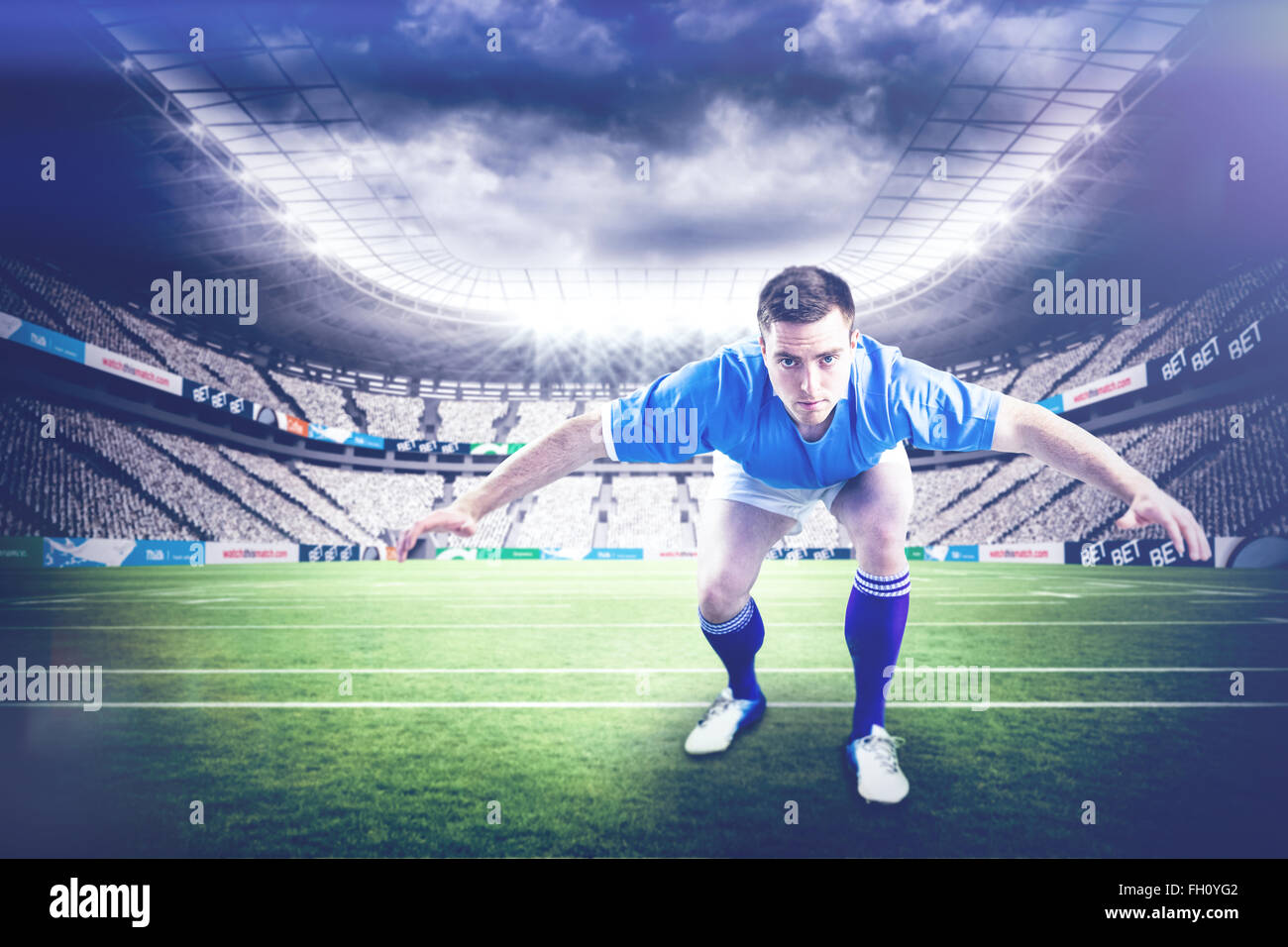 Composite image of rugby player with hands on hips Stock Photo - Alamy