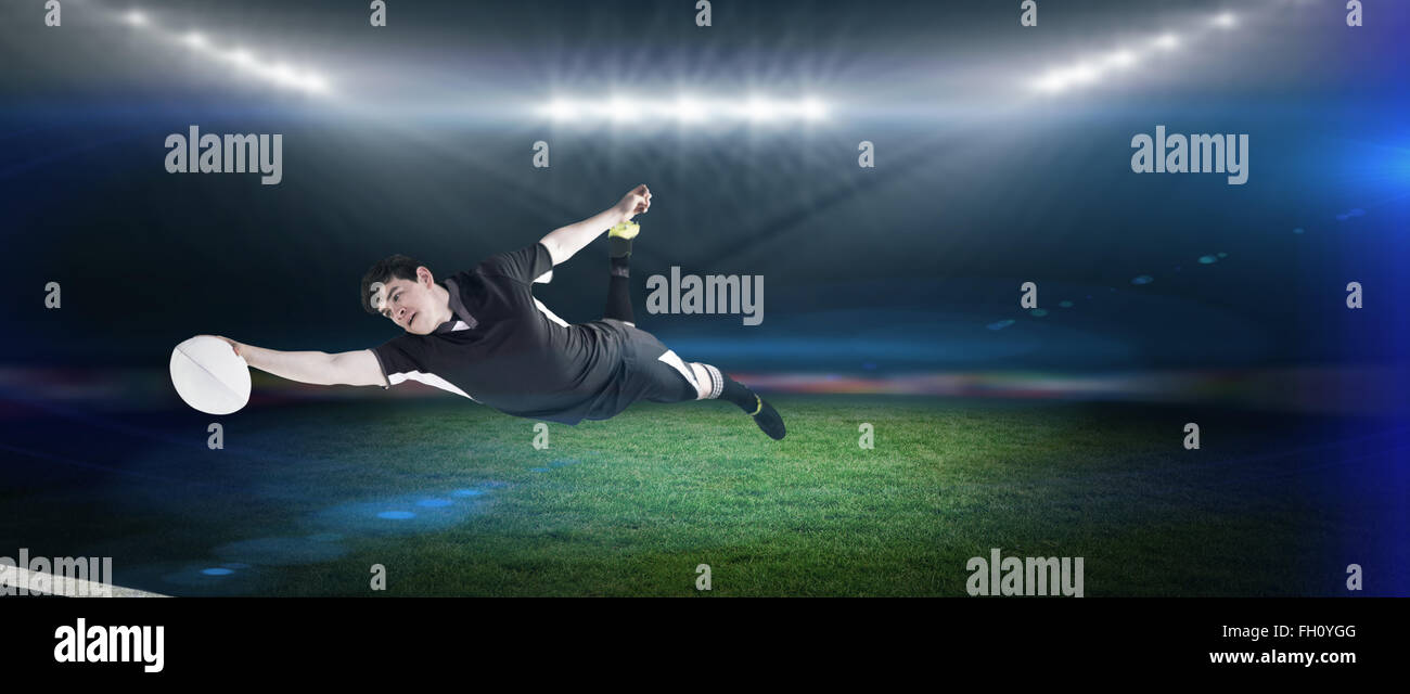 Composite image of a rugby player scoring a try Stock Photo - Alamy