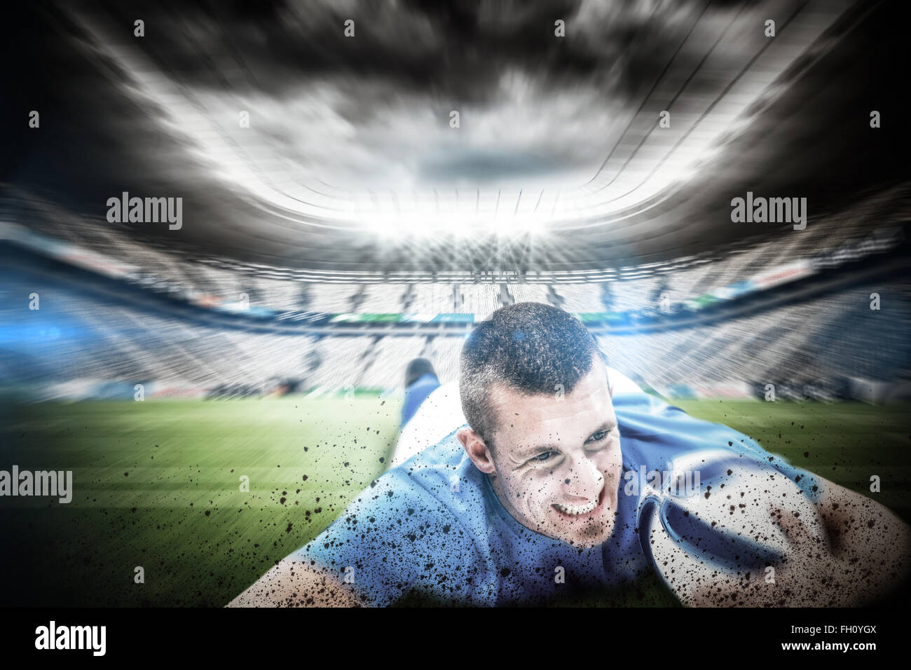 Composite image of confident rugby player lying in front with ball ...