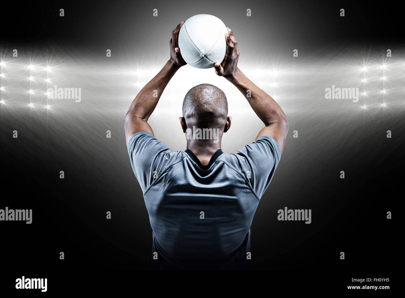 Composite image of athlete throwing rugby ball Stock Photo - Alamy