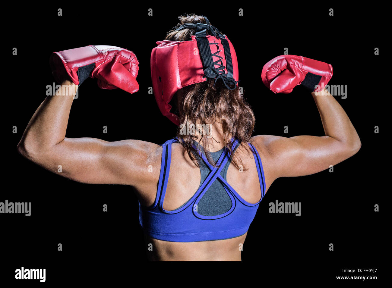 Rear view of fighter flexing muscles Stock Photo - Alamy