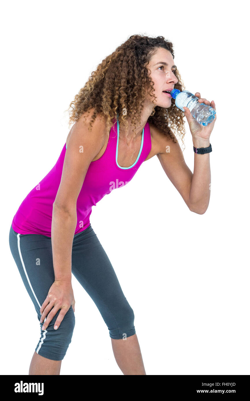 Sporty brunette woman drinking water hi-res stock photography and ...