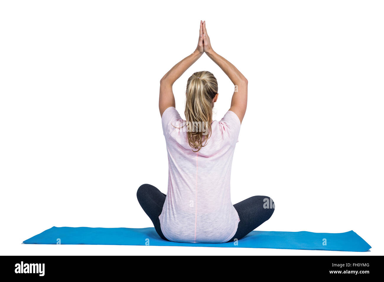 Rear view of fit woman in yoga position Stock Photo - Alamy