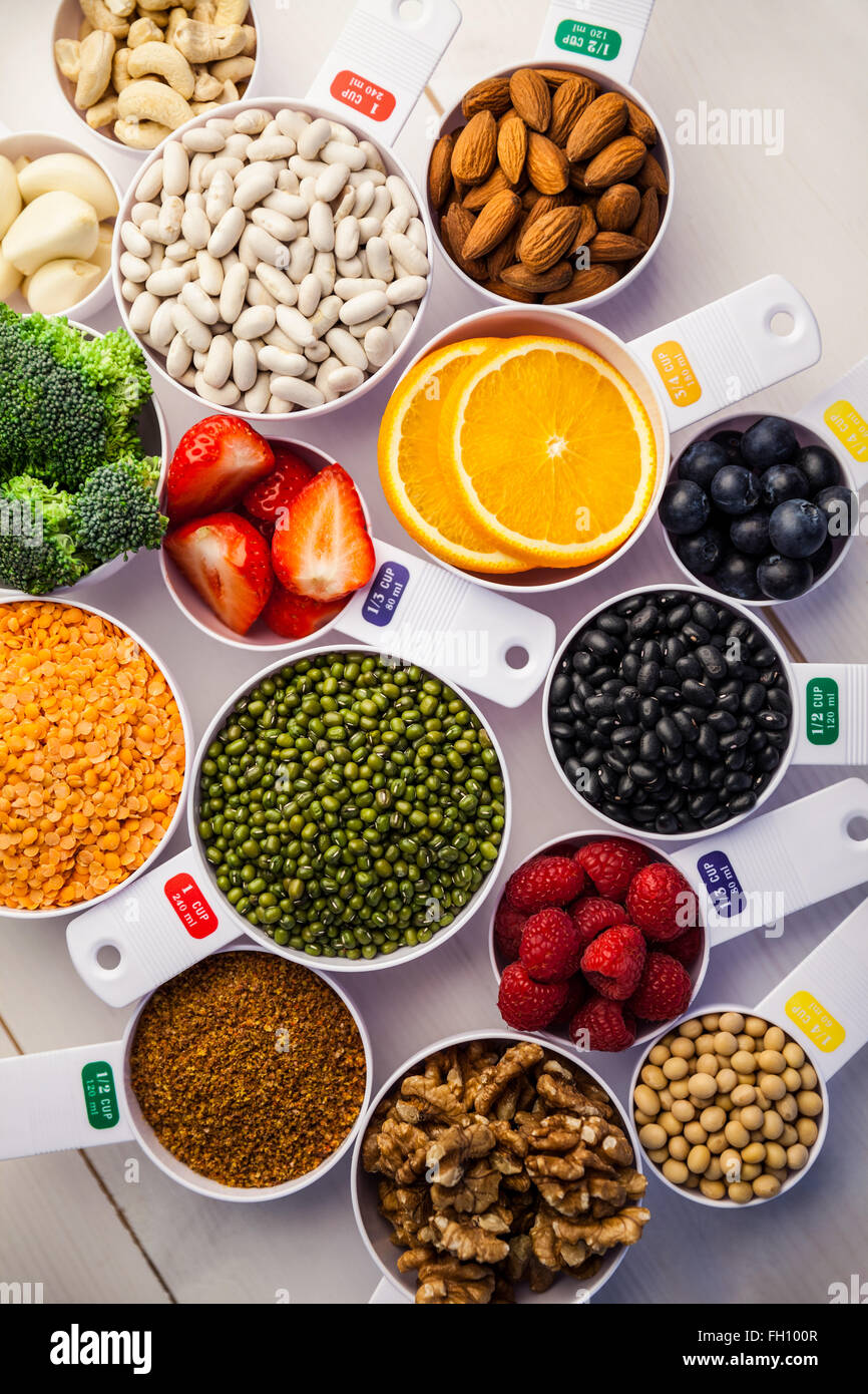 Portion cups of healthy ingredients Stock Photo - Alamy