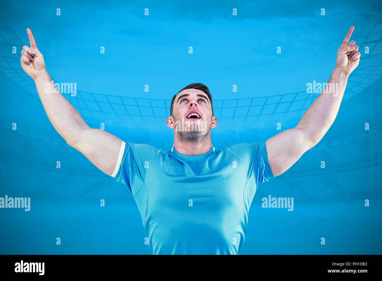 Composite image of rugby player cheering and pointing Stock Photo - Alamy