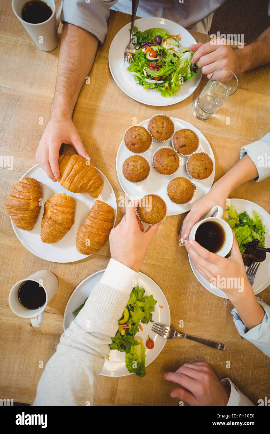 Business people having snacks in canteen Stock Photo - Alamy
