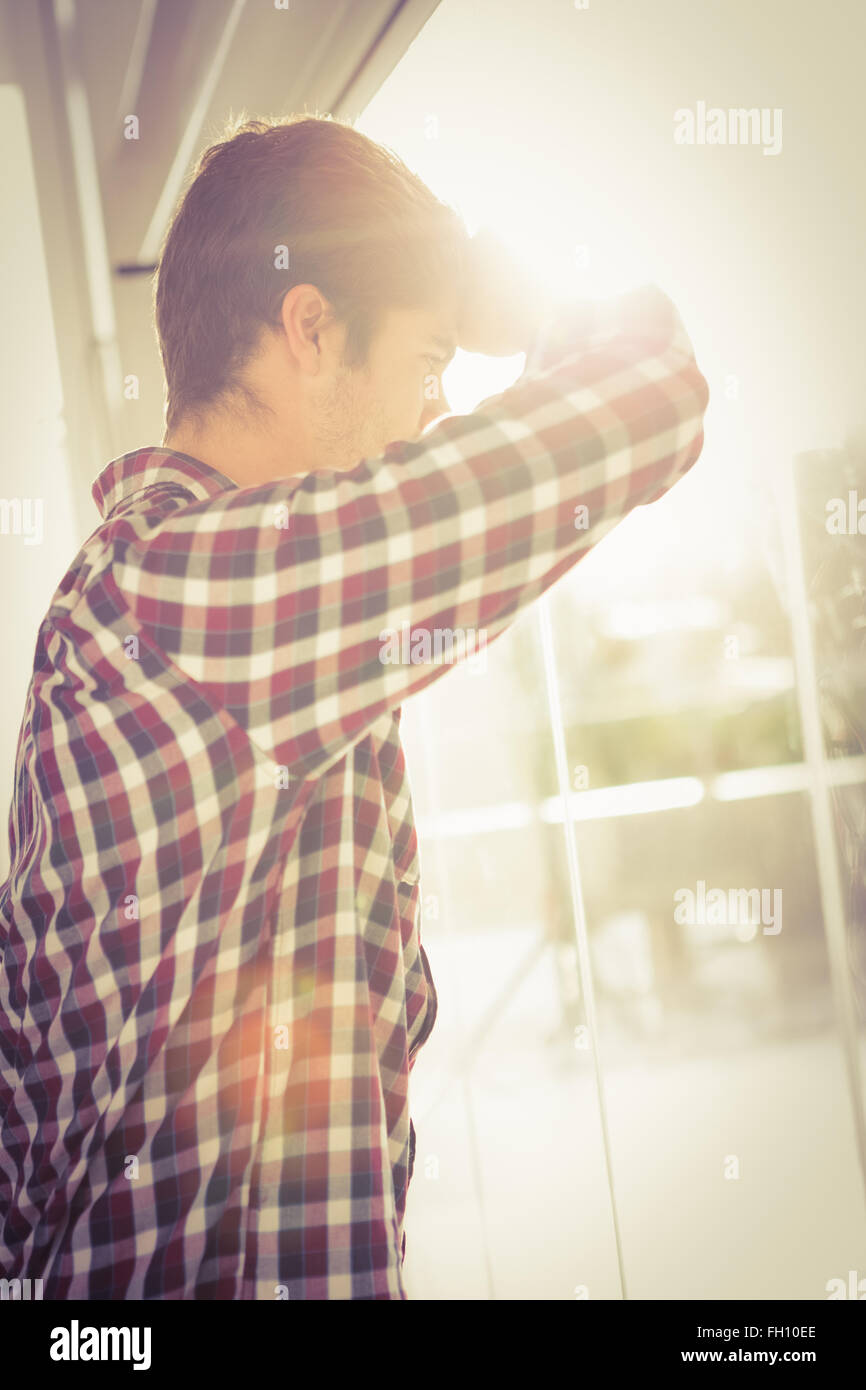 Thoughtful male executive looking through hi-res stock photography and ...