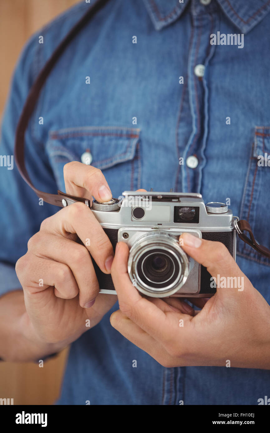 Man adjusting camera lens Stock Photo - Alamy