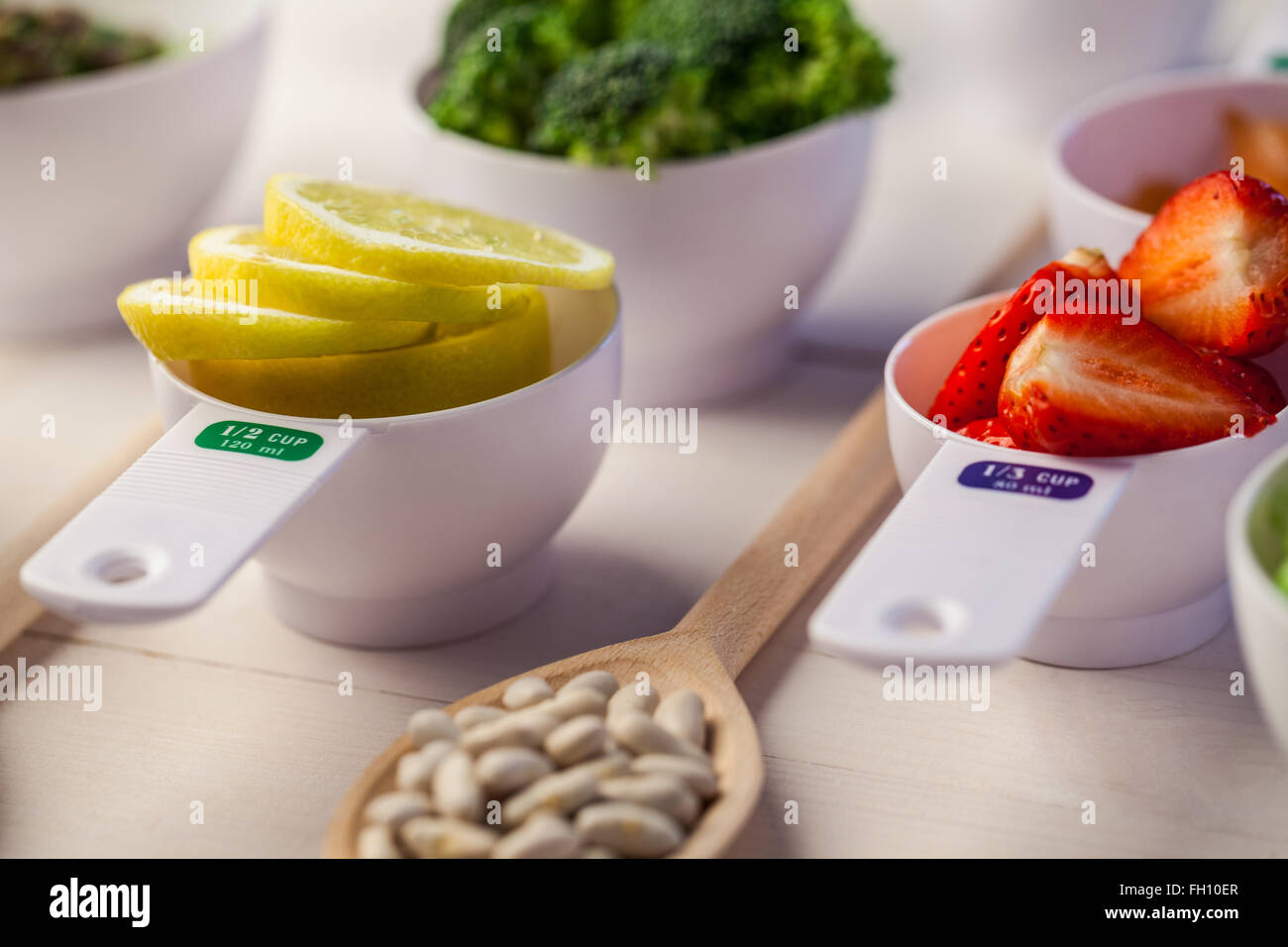 Portion cups of healthy ingredients Stock Photo - Alamy
