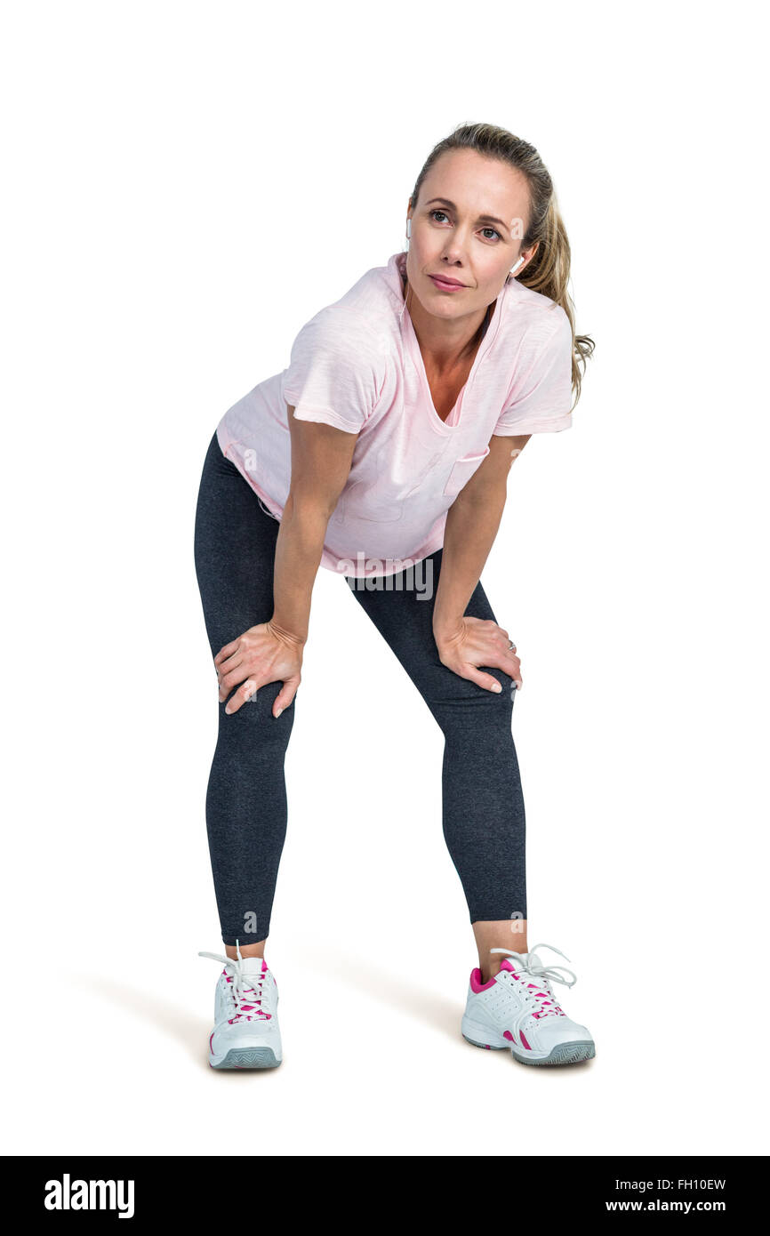 Thoughtful sporty woman bending Stock Photo - Alamy