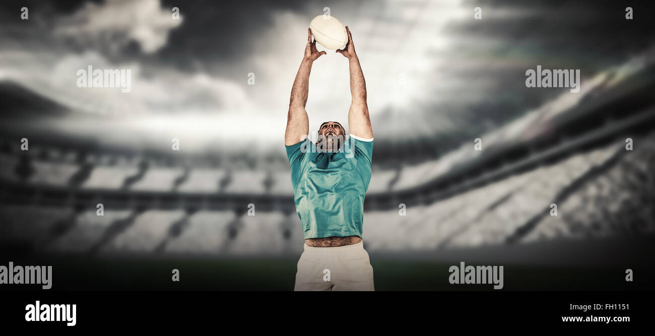 Composite image of rugby player catching the ball Stock Photo - Alamy