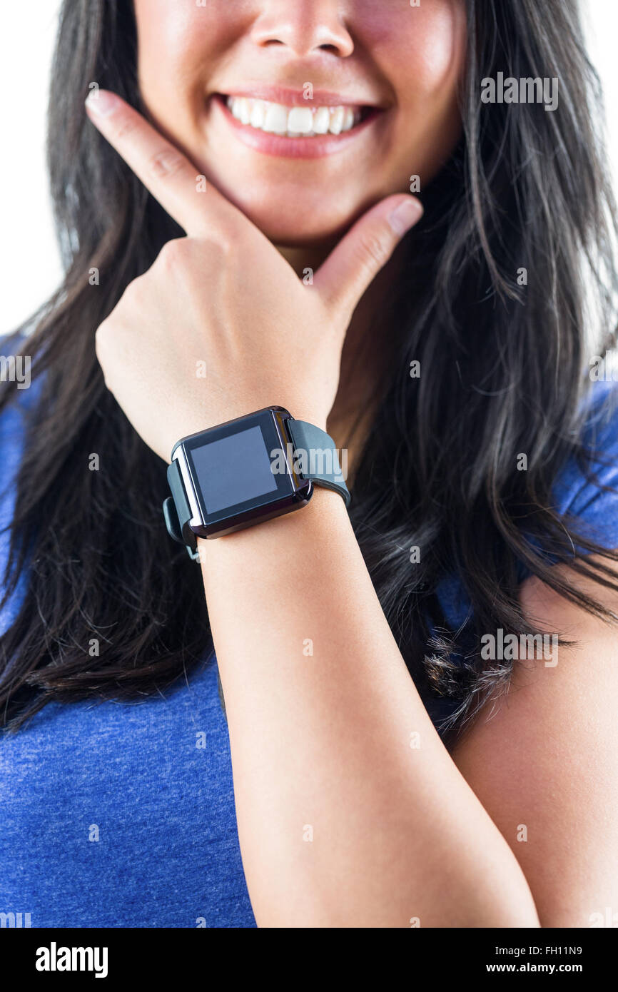 Cute woman wearing her smartwatch Stock Photo - Alamy