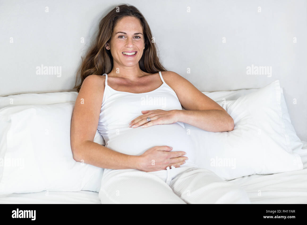 Portrait of pregnant woman relaxing Stock Photo - Alamy