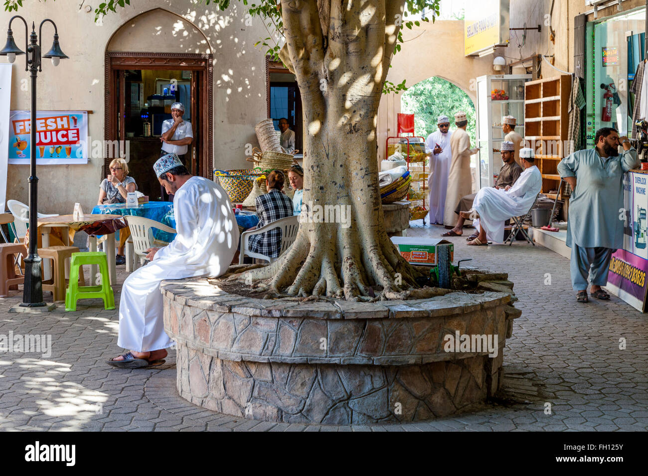 People Sit Chatting At A Cafe In The Souk, Nizwa, Ad Dakhiliyah Region ...