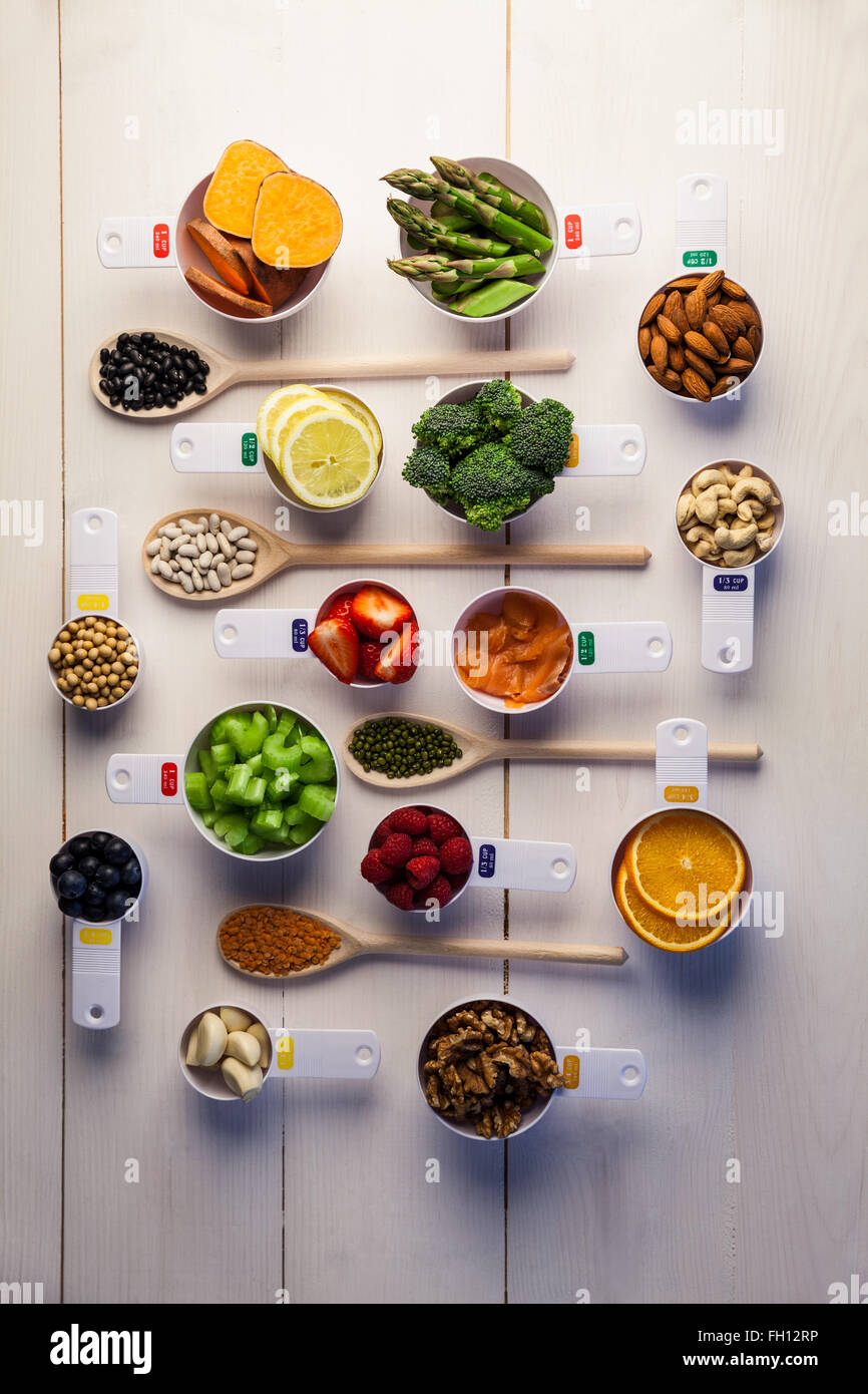 Portion cups of healthy ingredients Stock Photo - Alamy