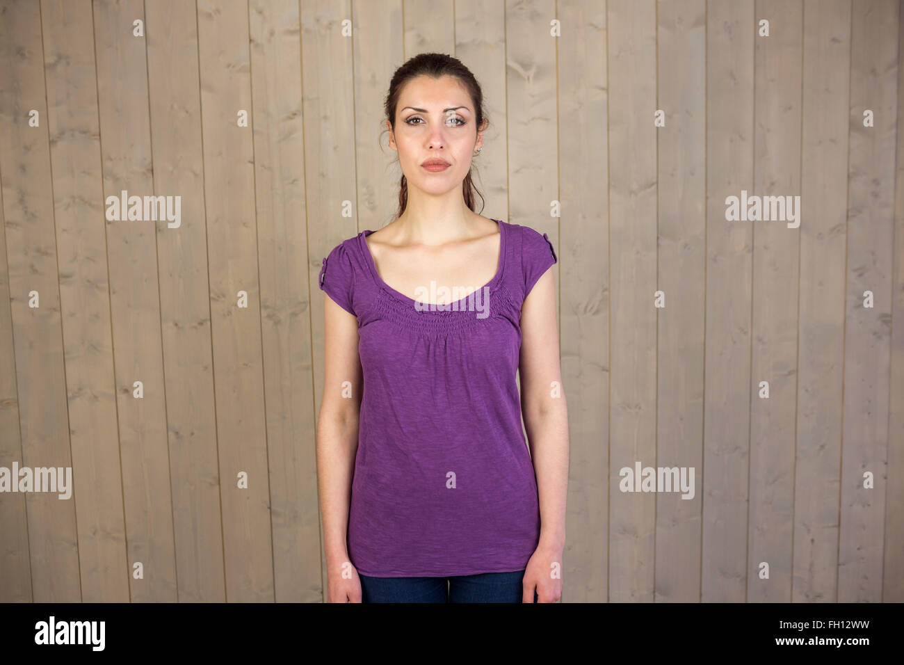 Woman standing at home Stock Photo - Alamy