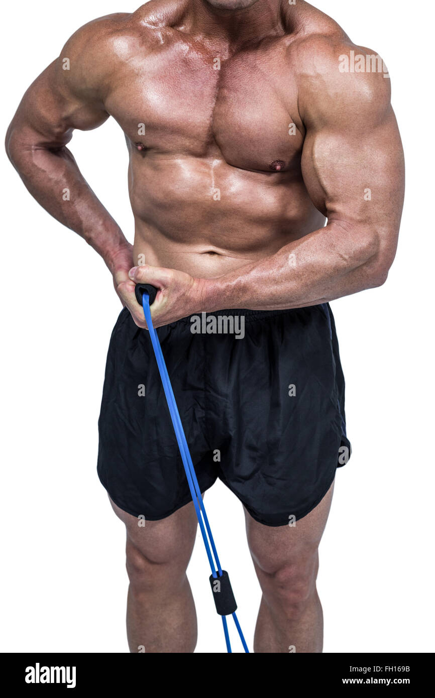 Midsection of bodybuilder pulling elastic rope Stock Photo - Alamy