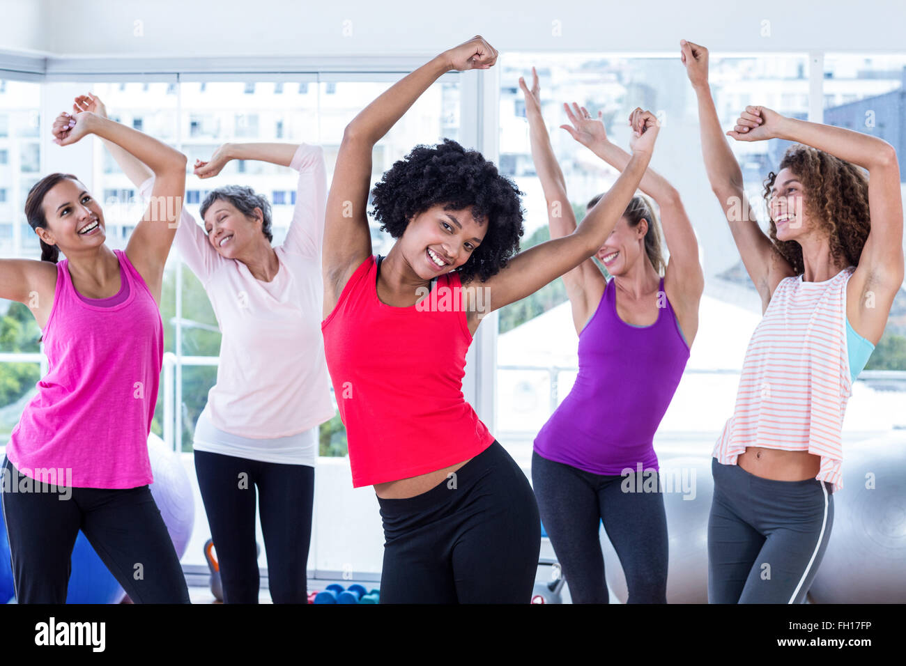 women exercising with arms raised Stock Photo - Alamy
