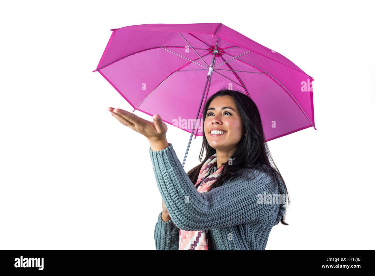 Woman checking the weather from under her umbrella Stock Photo - Alamy