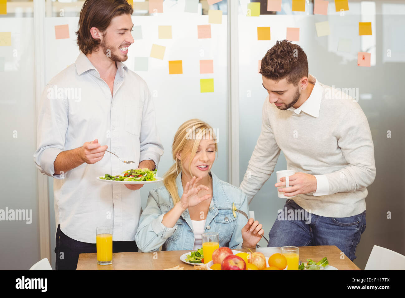 Employees having breakfast Stock Photo - Alamy