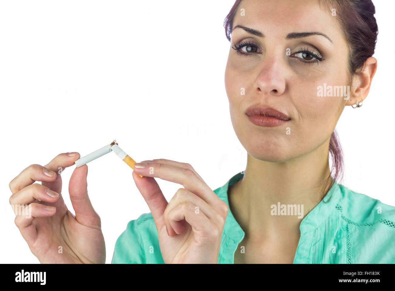 Close-up portrait of woman breaking cigarette Stock Photo - Alamy