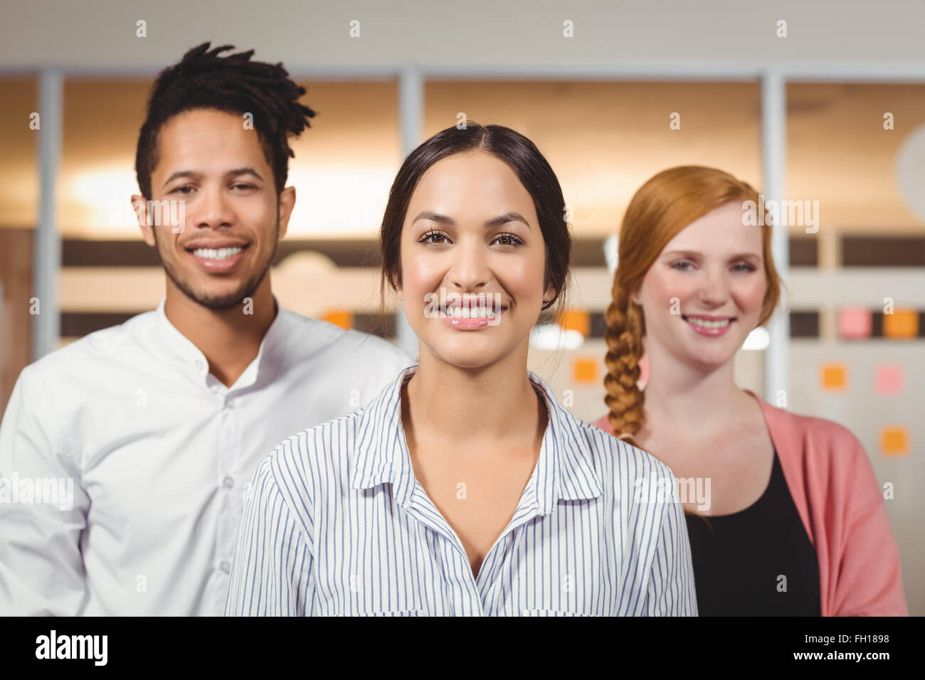 Portrait of confident smiling colleagues Stock Photo - Alamy