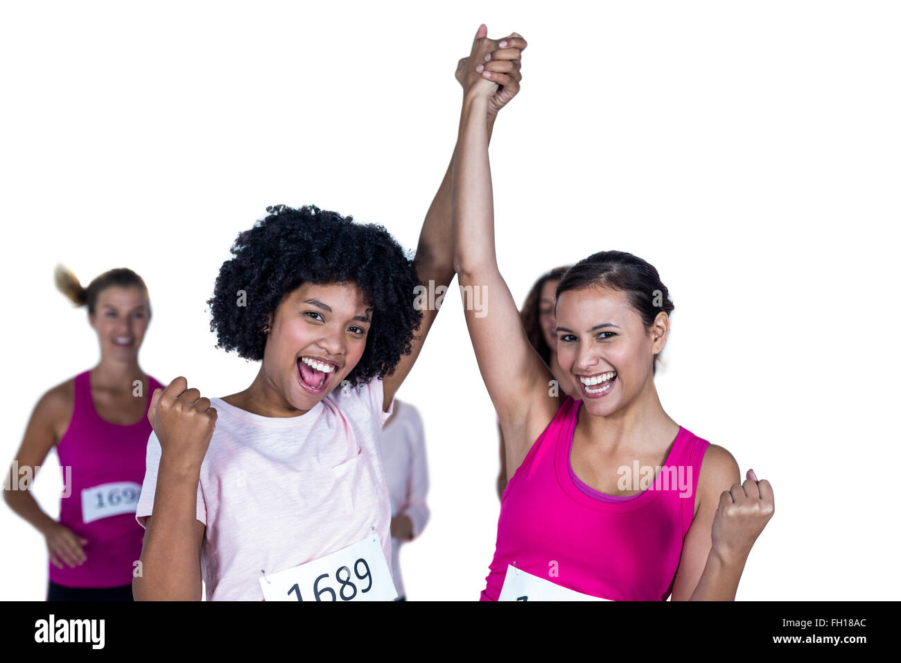 Portrait of smiling winner athletes with arms raised Stock Photo - Alamy