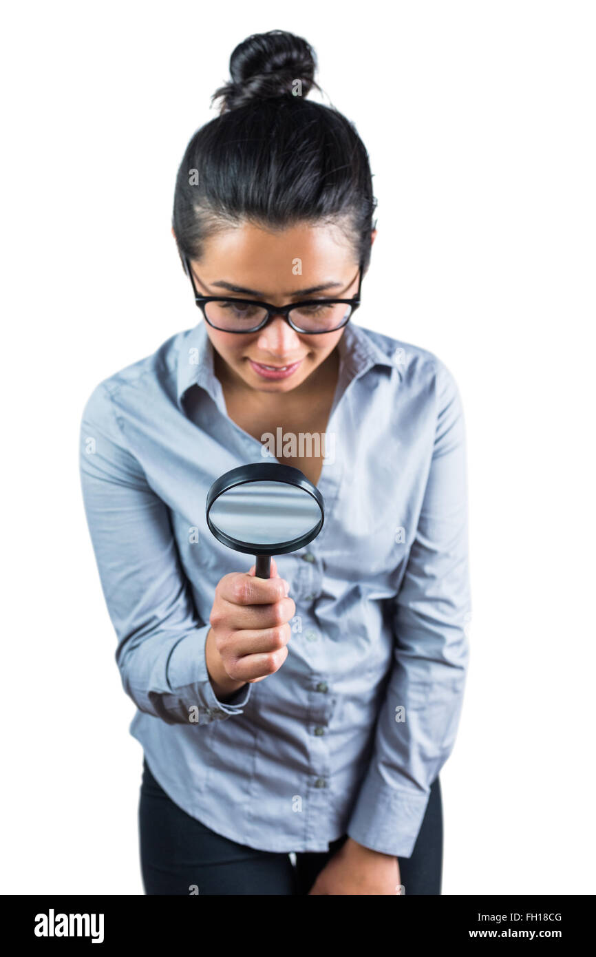 Woman examining with a magnifying glass Stock Photo - Alamy