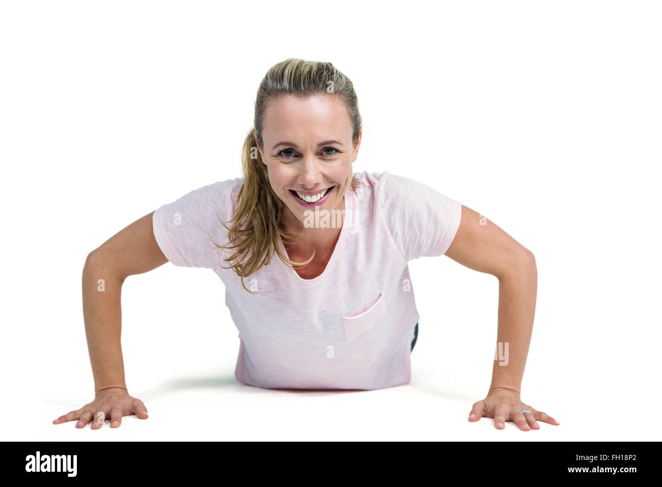 Portrait of happy fit woman doing push ups Stock Photo - Alamy