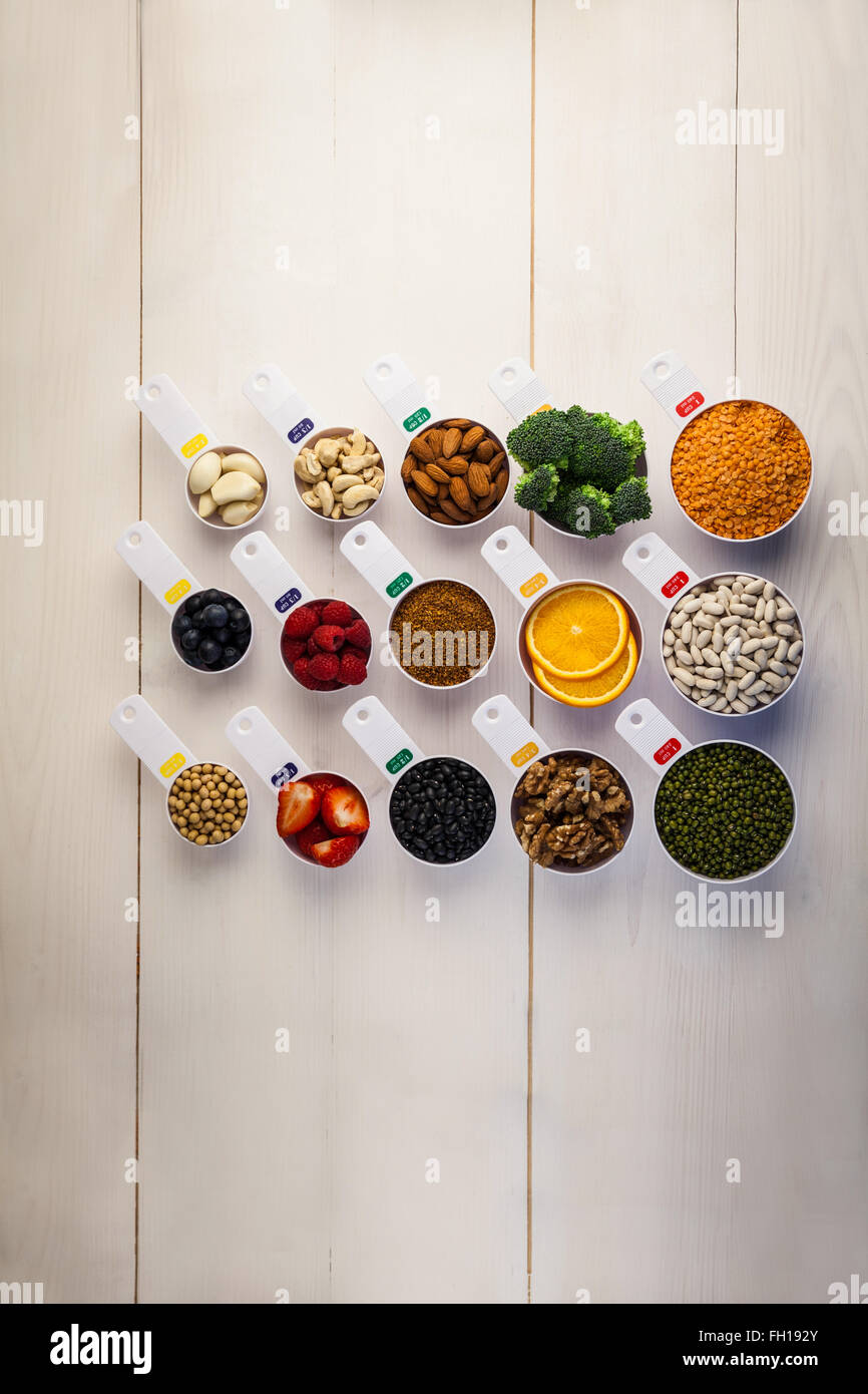 Portion cups of healthy ingredients Stock Photo - Alamy