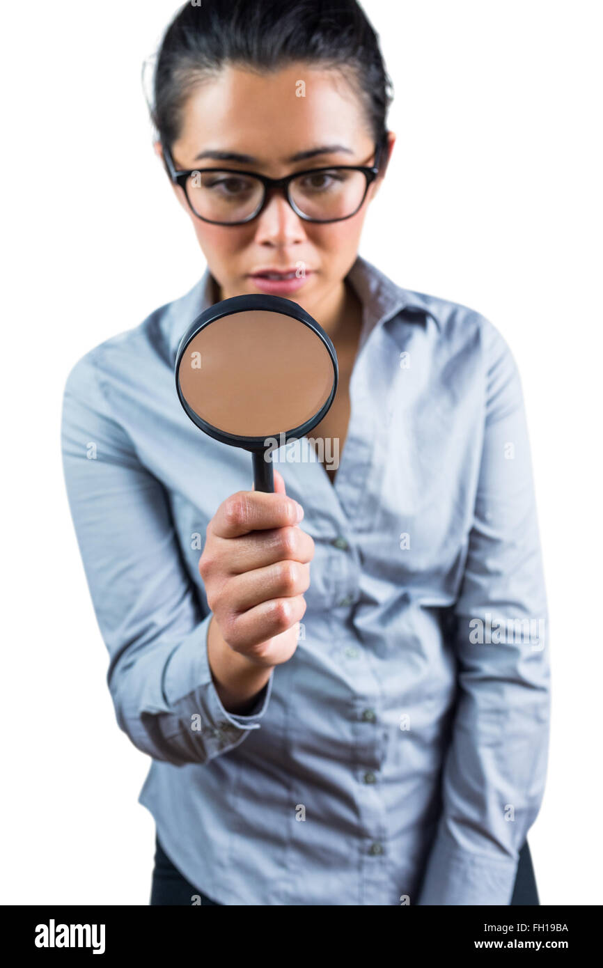 Woman examining with a magnifying glass Stock Photo - Alamy