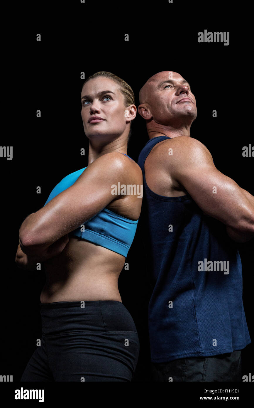 Low angle view of muscular man and woman Stock Photo - Alamy