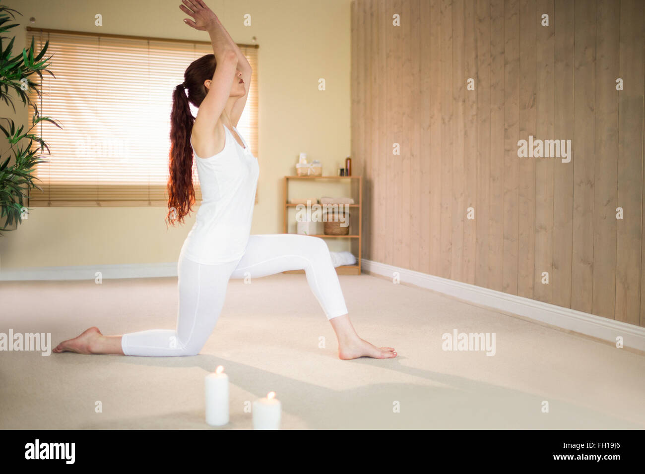 Side view of woman meditating with joined hands Stock Photo - Alamy