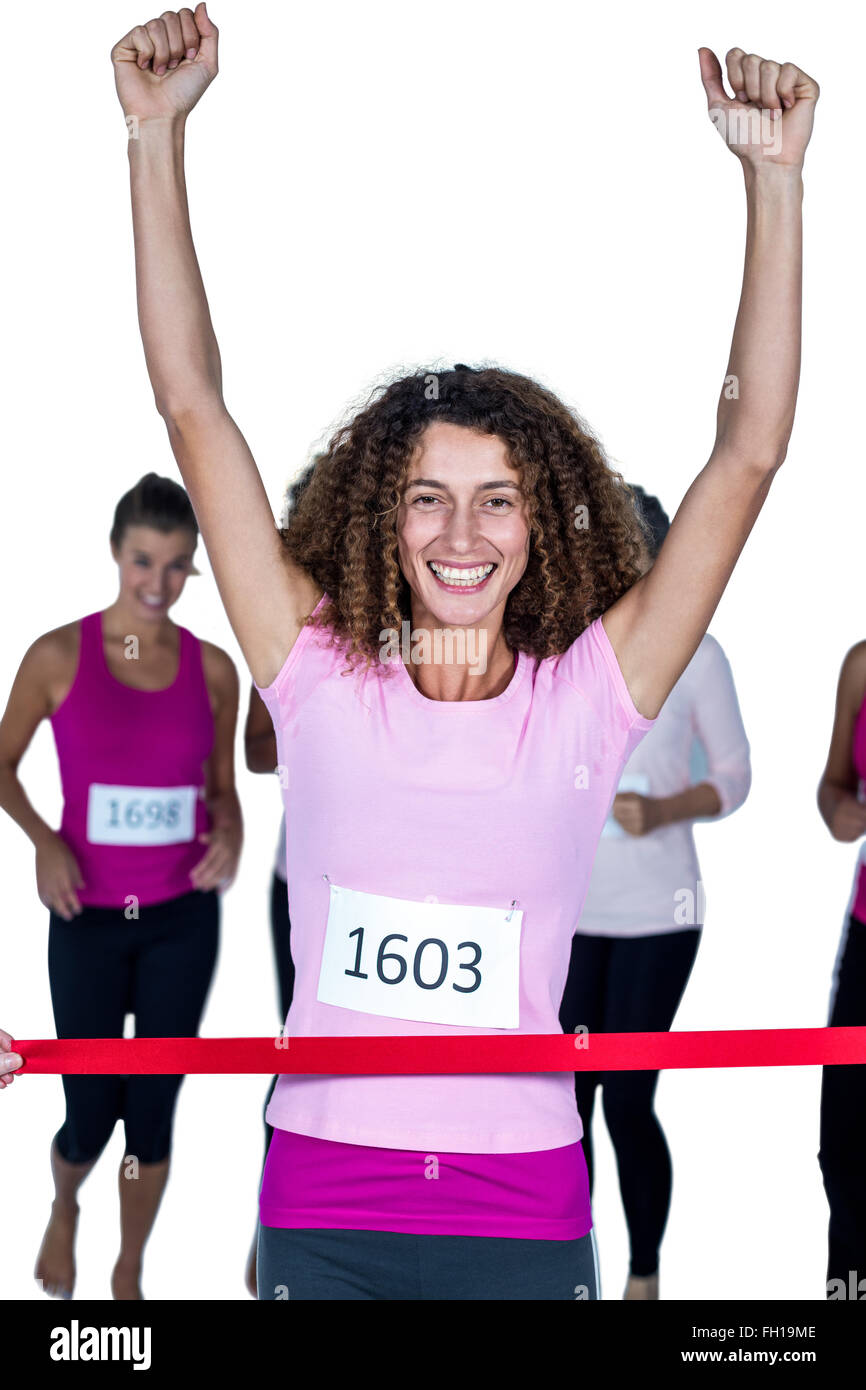 Female athlete crossing finish line hi-res stock photography and images ...