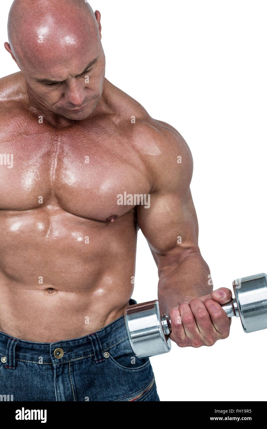 Muscular man lifting dumbbells Stock Photo - Alamy