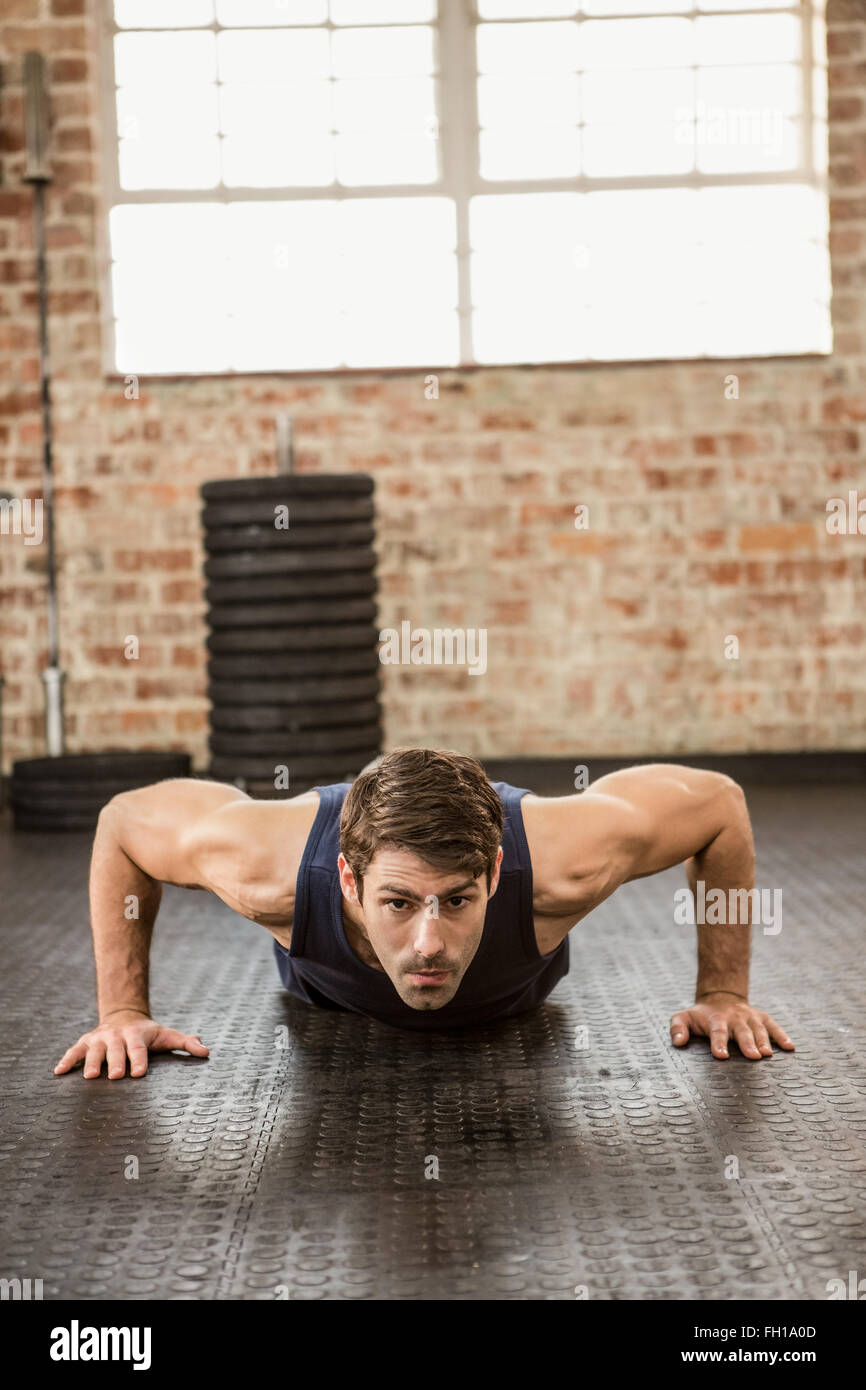Focused man doing wide arm push ups Stock Photo - Alamy