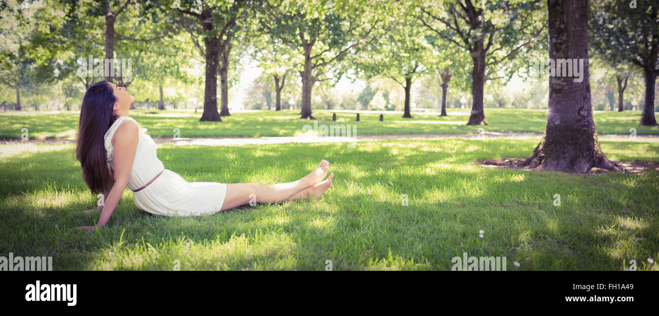 Young woman relaxing on grassland Stock Photo - Alamy
