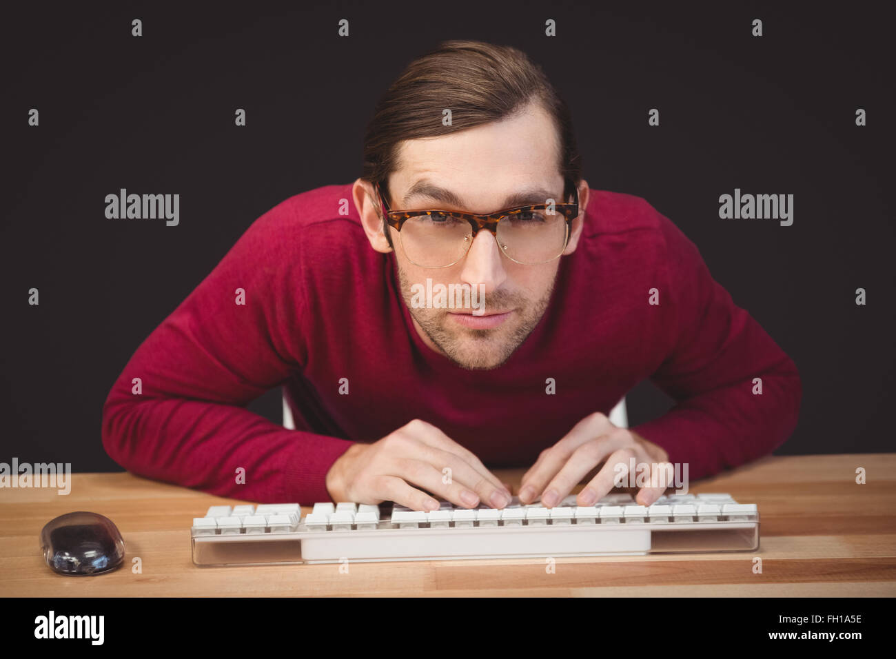 Portrait of concentrated man working on computer Stock Photo - Alamy