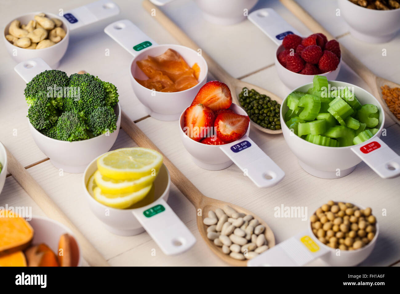 Portion cups of healthy ingredients Stock Photo - Alamy
