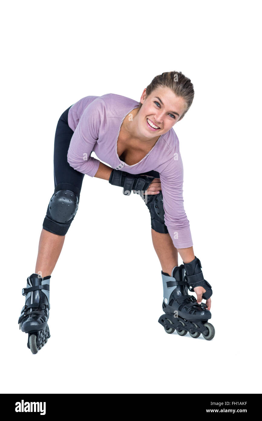 Portrait of happy woman inline skating Stock Photo - Alamy