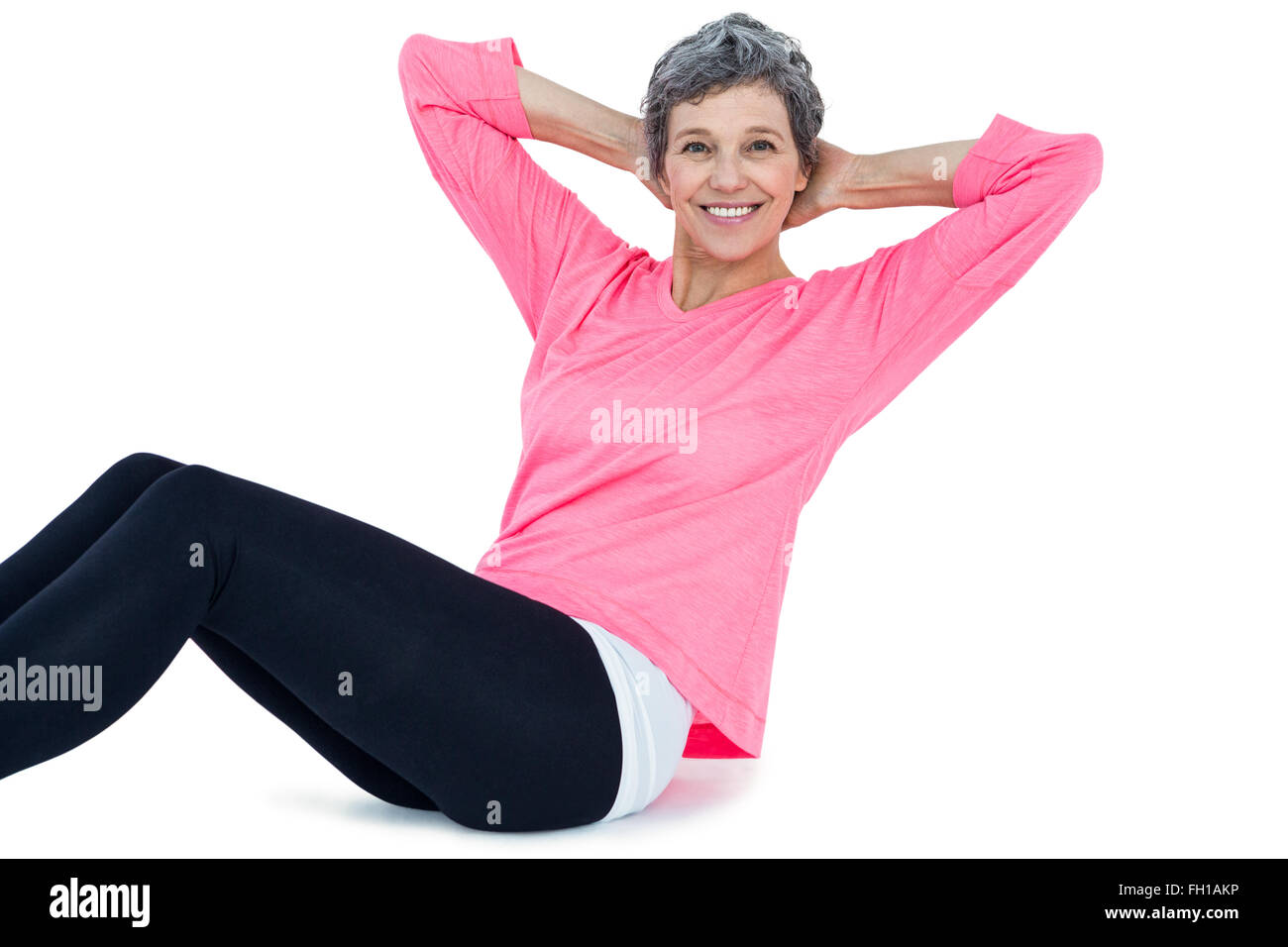 Portrait of mature woman doing sit ups Stock Photo - Alamy