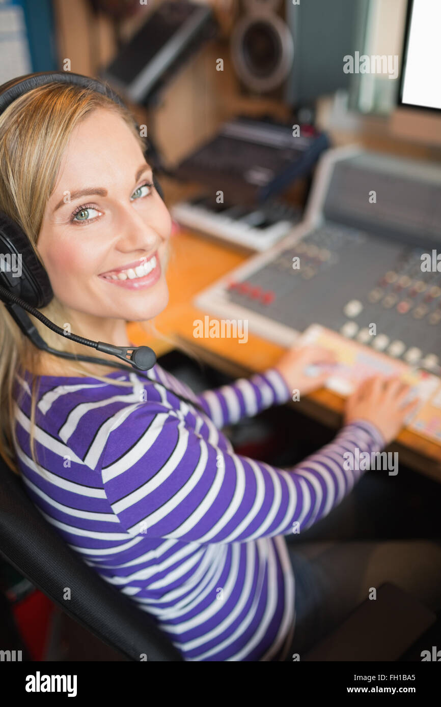 Happy young radio host in studio Stock Photo - Alamy