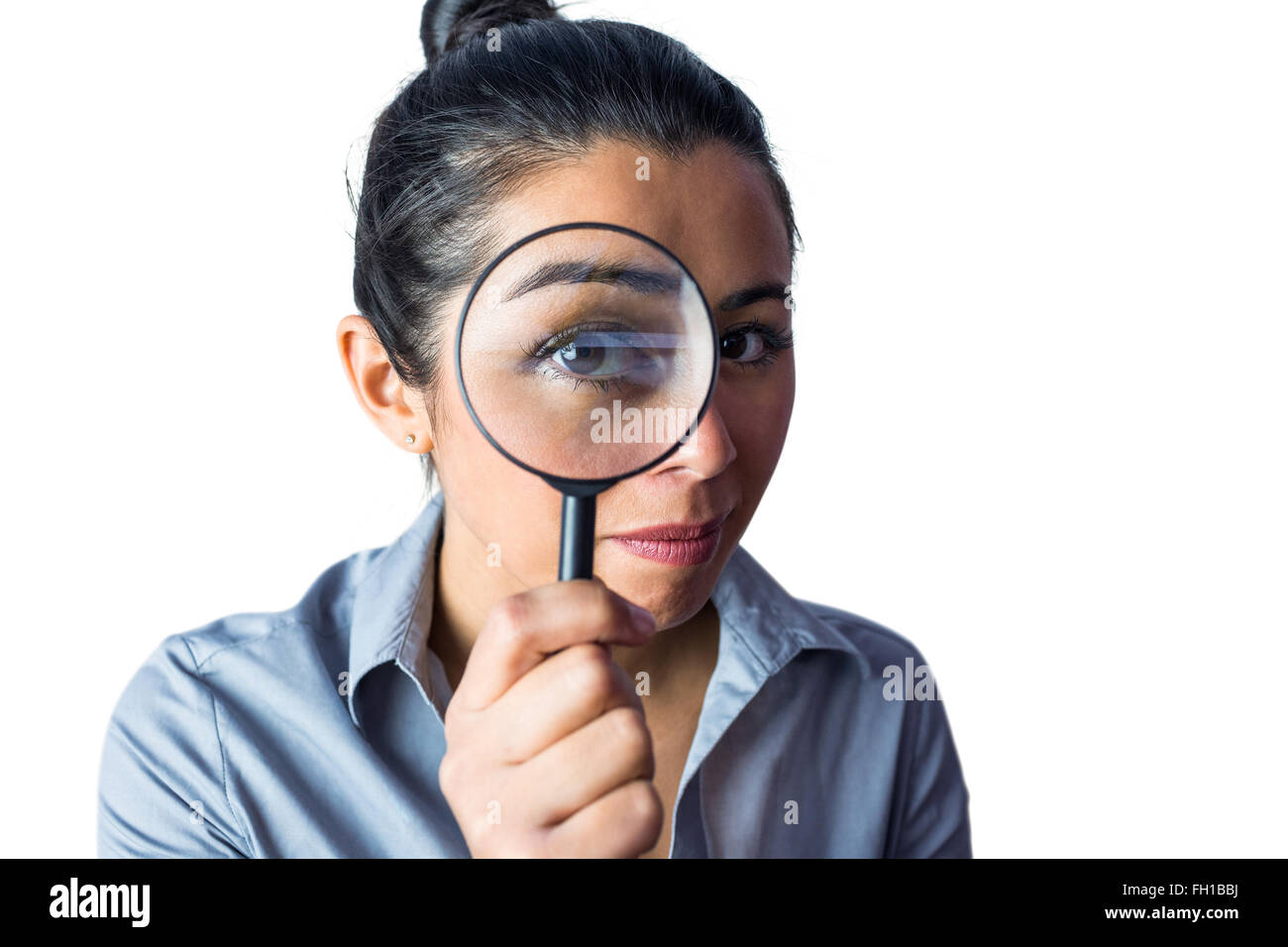 Woman examining with a magnifying glass Stock Photo - Alamy