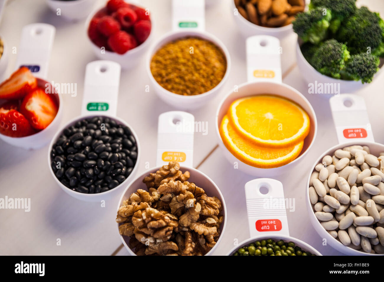 Portion cups of healthy ingredients Stock Photo - Alamy