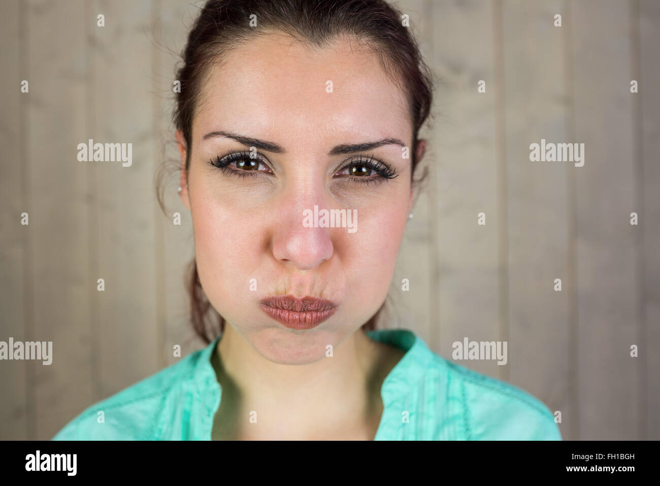 Portrait of beautiful woman making face Stock Photo - Alamy