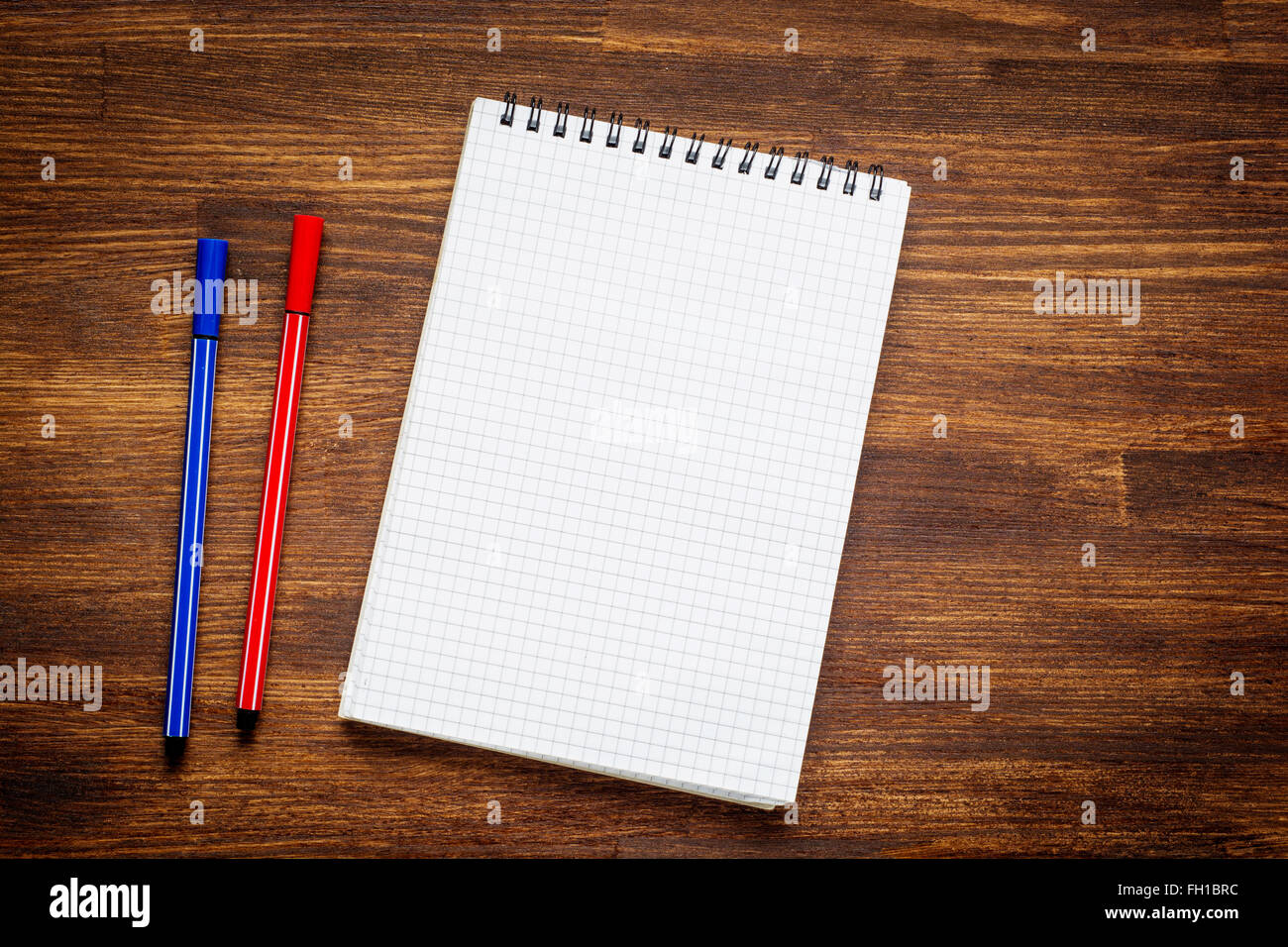 notebook and pen on wood table Stock Photo - Alamy