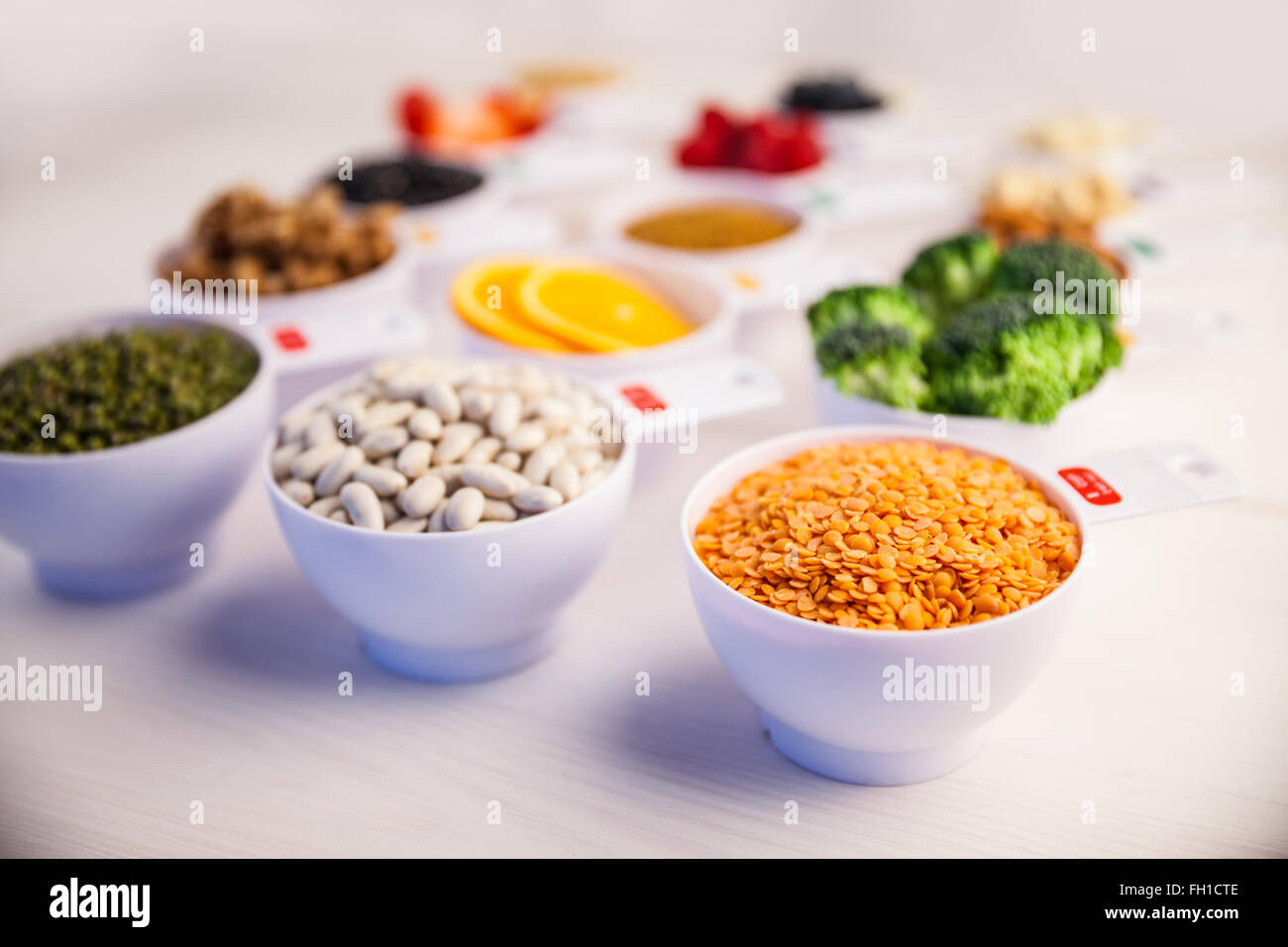 Portion cups of healthy ingredients Stock Photo - Alamy