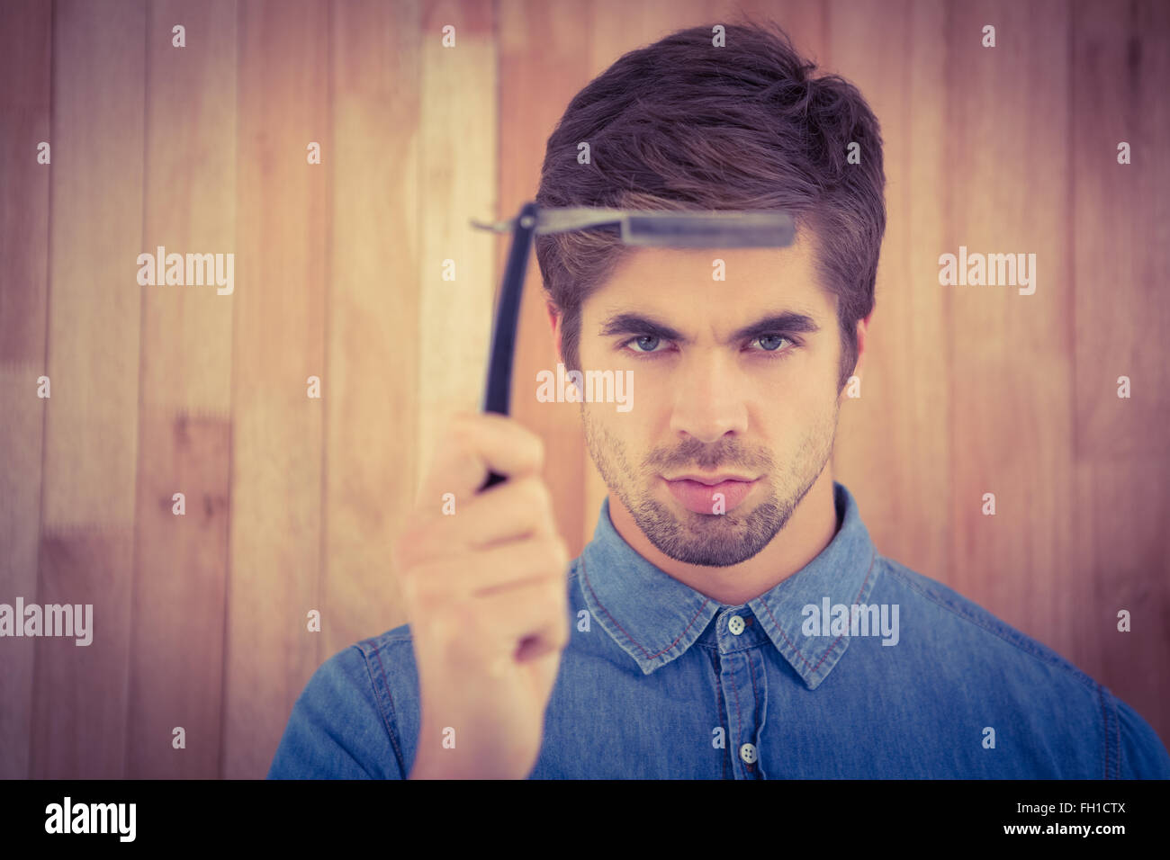 Portrait of serious hipster holding straight edge razor Stock Photo - Alamy